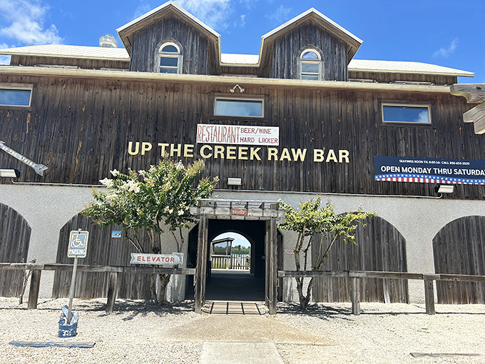 Up The Creek Raw Bar—where weathered wood, fresh seafood, and that archway entrance promise authentic Florida without even trying.