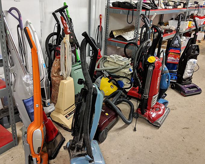 The vacuum graveyard where optimistic cleaning ambitions come to rest between owners.