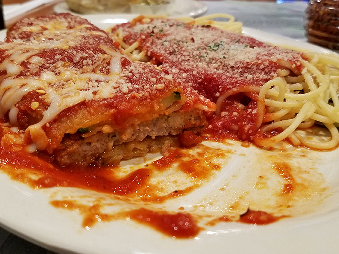 Veal parmesan that's seen more cheese than a Wisconsin dairy farm. The pasta alongside isn't just a side &ndash; it's a worthy companion.