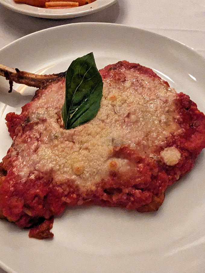 Veal parmigiano with a single basil leaf standing guard&mdash;simple, classic, and utterly incapable of disappointing anyone with taste buds.