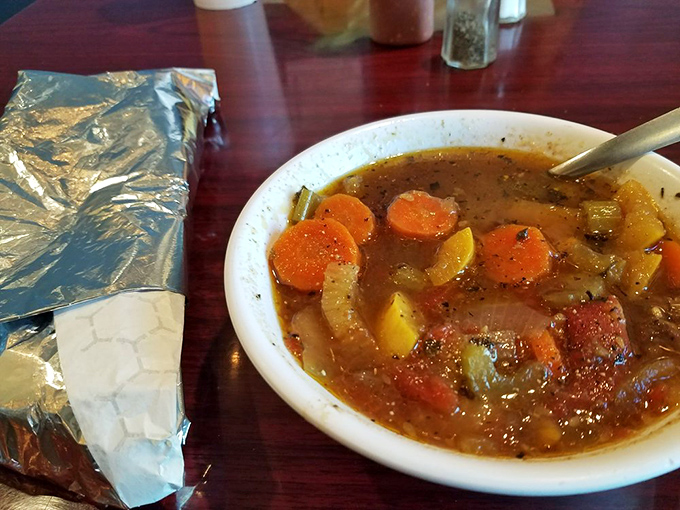 A hearty vegetable beef stew that would make your grandmother nod in approval, served alongside fry bread for the ultimate comfort meal.