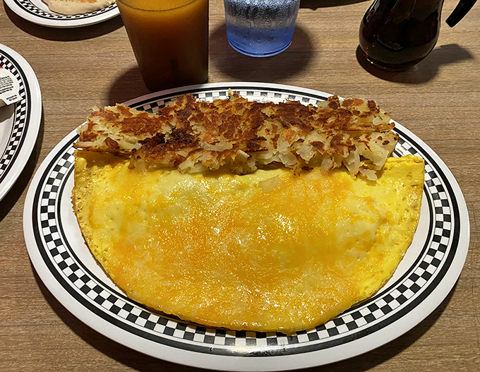 This omelet doesn't just sit there looking pretty&mdash;it arrives with a crown of perfectly crisped hash browns that would make any potato proud.