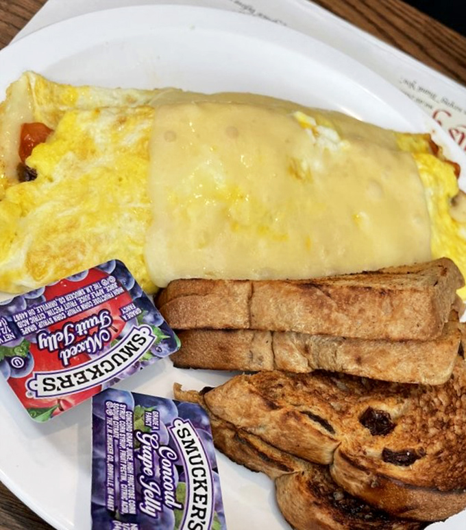 An omelet that's practically a work of art&mdash;cheese melting over perfectly cooked eggs with toast standing by for the encore.