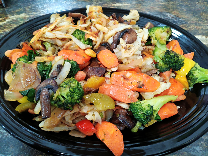 A colorful medley of vegetables transforms ordinary hash browns into a garden party your taste buds actually want to attend.