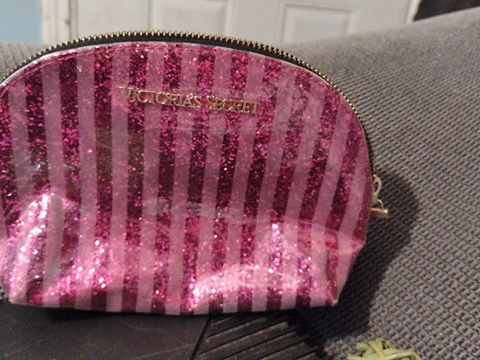 From Victoria's not-so-secret stash comes this sparkly pink cosmetic bag, barely used and ready for a second glamorous life.