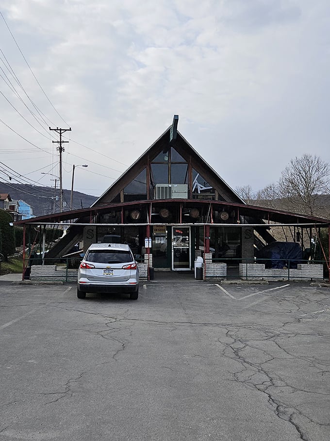 A-frame architecture meets small-town charm at this local eatery, where the building's distinctive silhouette promises comfort food with a view of the hills.