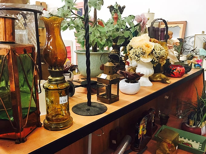 Vintage treasures that whisper stories of past lives. That amber glass lamp probably illuminated someone's first reading of "The Great Gatsby."