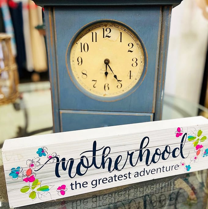 Time stands still at 4 on this vintage blue clock, perhaps waiting for someone new to wind its springs and bring its tick-tock back to life.