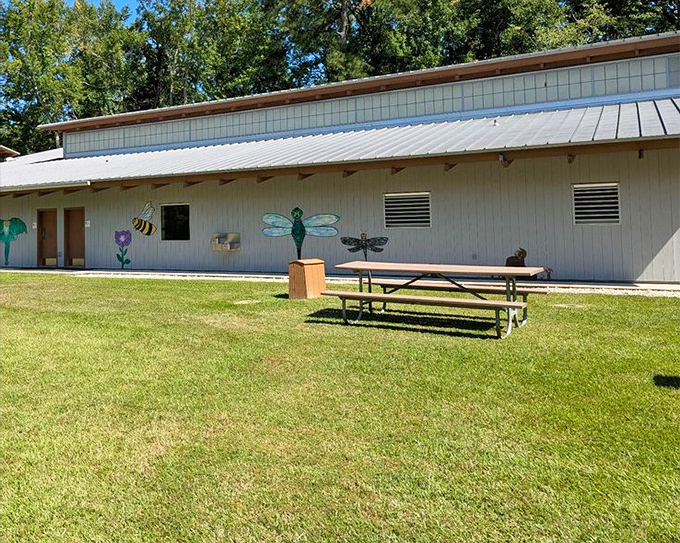 Whimsical wildlife art adorns the facilities. Even the restroom building gets the nature-inspired treatment at this thoughtfully designed park.