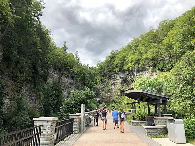 The entrance path invites visitors into the gorge's embrace, where everyday worries dissolve faster than aspirin. Nature's stress management program.