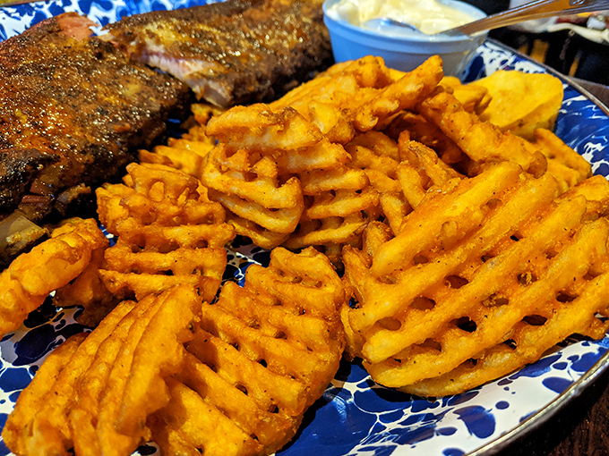 Waffle fries that achieve the golden trifecta: crispy edges, fluffy centers, and enough structural integrity to transport sauce from plate to mouth.