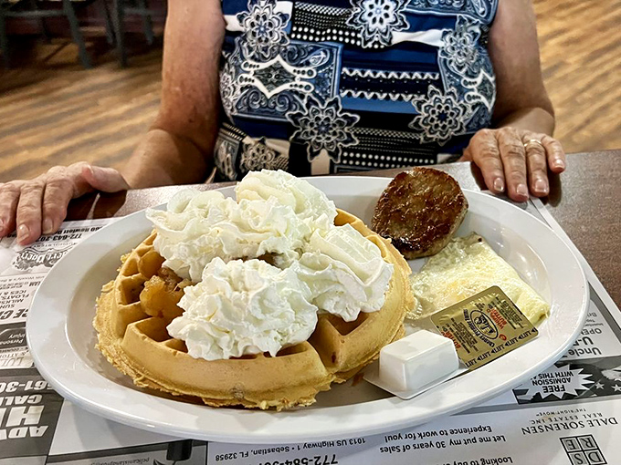 Waffle royalty crowned with clouds of whipped cream – the breakfast that makes you wonder why anyone bothers with avocado toast anymore.