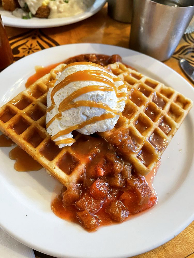 Waffles crowned with seasonal compote and whipped cream&mdash;proof that sometimes the best architecture in Cleveland isn't in a museum, it's on your breakfast plate.