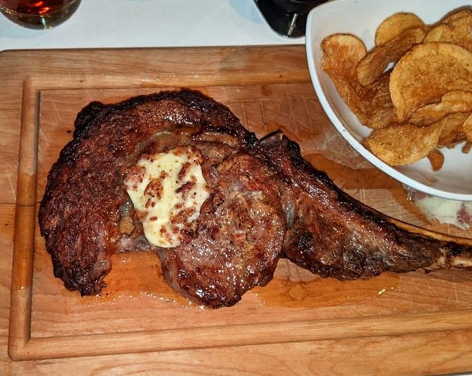This isn't just a steak&mdash;it's a primal experience on a wooden board, with butter melting like a summer romance on top.