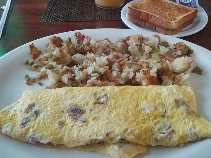 That Western omelet comes loaded with all the right ingredients, folded around home fries that understand their assignment perfectly.