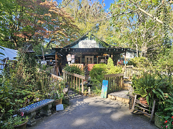 Wildflower Café's garden entrance promises culinary magic inside that log cabin – tomato pie pilgrims, rejoice!