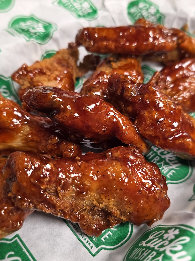 These honey BBQ wings glisten with sticky-sweet sauce, demanding you abandon all dignity and embrace the finger-licking experience.