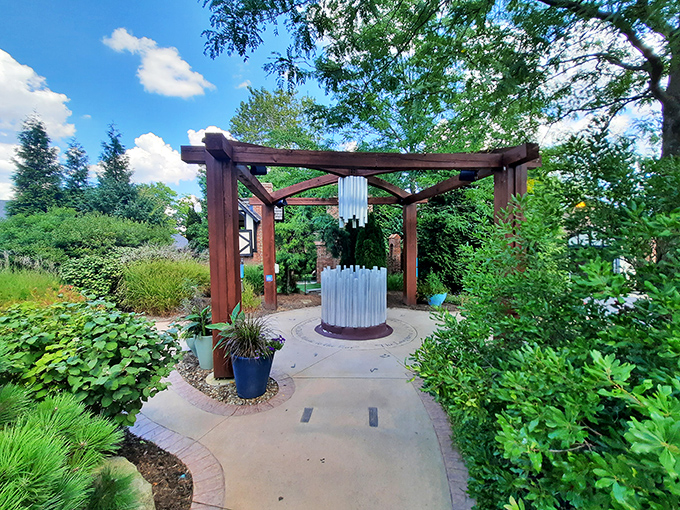 Modern sculpture meets traditional garden design in this peaceful corner where contemplation comes naturally&mdash;unlike at home where contemplation is interrupted by neighbors mowing lawns.