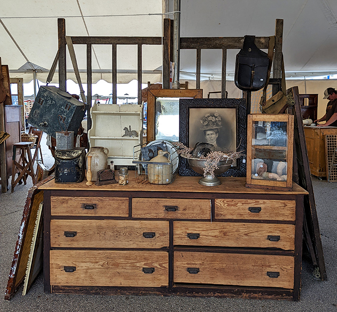 A perfectly weathered dresser topped with curiosities – the furniture equivalent of a well-lived life seeking its next chapter.