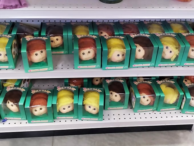 An army of identical dolls stands at attention, their hopeful expressions suggesting they're ready for their forever homes.