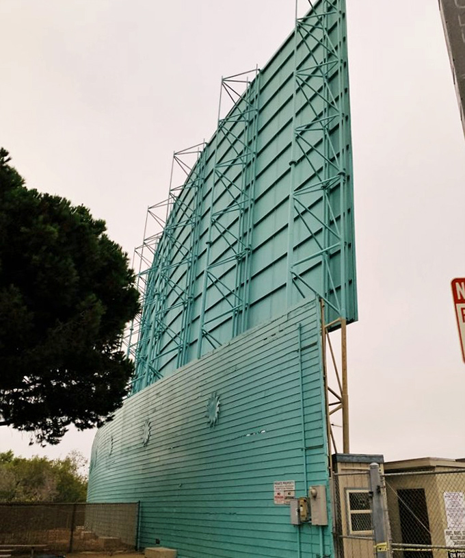 The aqua-colored back of the screen stands like a giant sail, a relic from simpler times when entertainment didn't require a password.