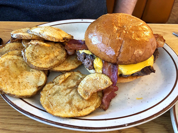 A burger that understands the assignment&mdash;beef, bacon, and cheese in perfect harmony, with home fries playing backup.