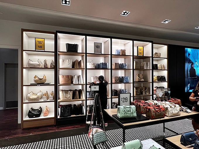 The handbag wall at the outlet mall&mdash;where purses are displayed like fine art and your budget stretches further than downtown.