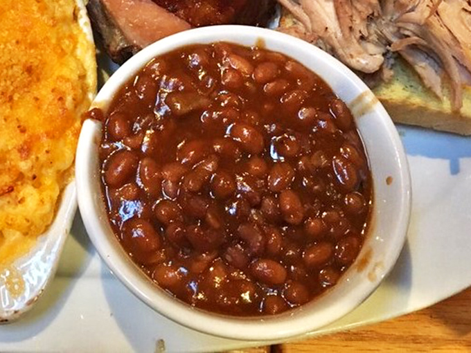 Molasses-infused baked beans studded with smoky meat bits &ndash; proof that even the humblest side dish can achieve greatness in the right hands.