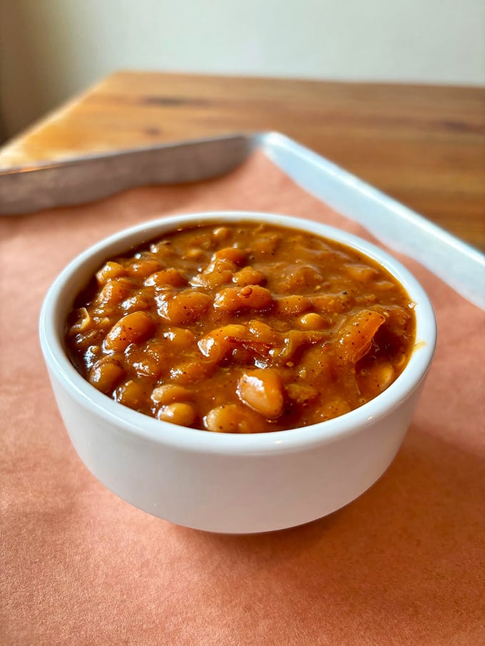 These aren't your average baked beans. They've been simmering alongside barbecue royalty, absorbing smoky essence and developing flavors that canned versions can only dream about.