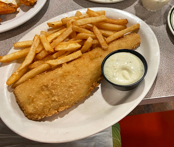 Golden-battered cod that shatters with each bite, paired with crispy fries and house-made tartar sauce. Fish this good is no small fry.