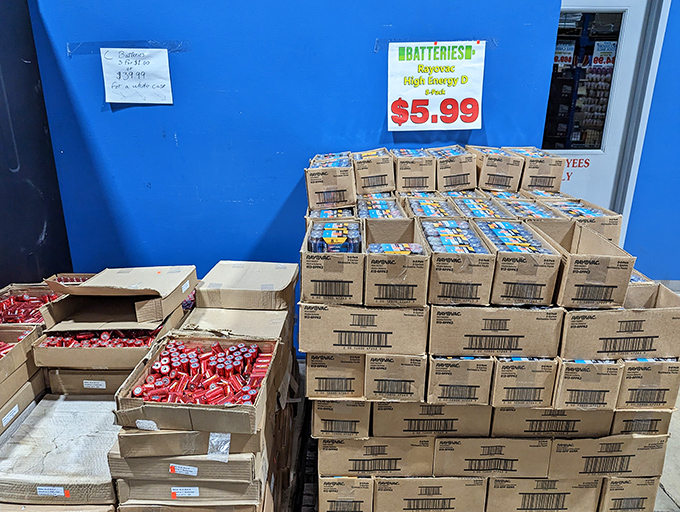 Battery bonanza! The sign proclaims "$5.99" with the enthusiasm of someone who knows the true value of never running out of power when the remote dies mid-binge.