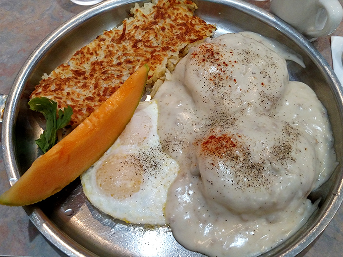 A skillet breakfast that's essentially breakfast's greatest hits album&mdash;crispy hash browns, perfectly cooked eggs, and gravy that demands to be sopped up.