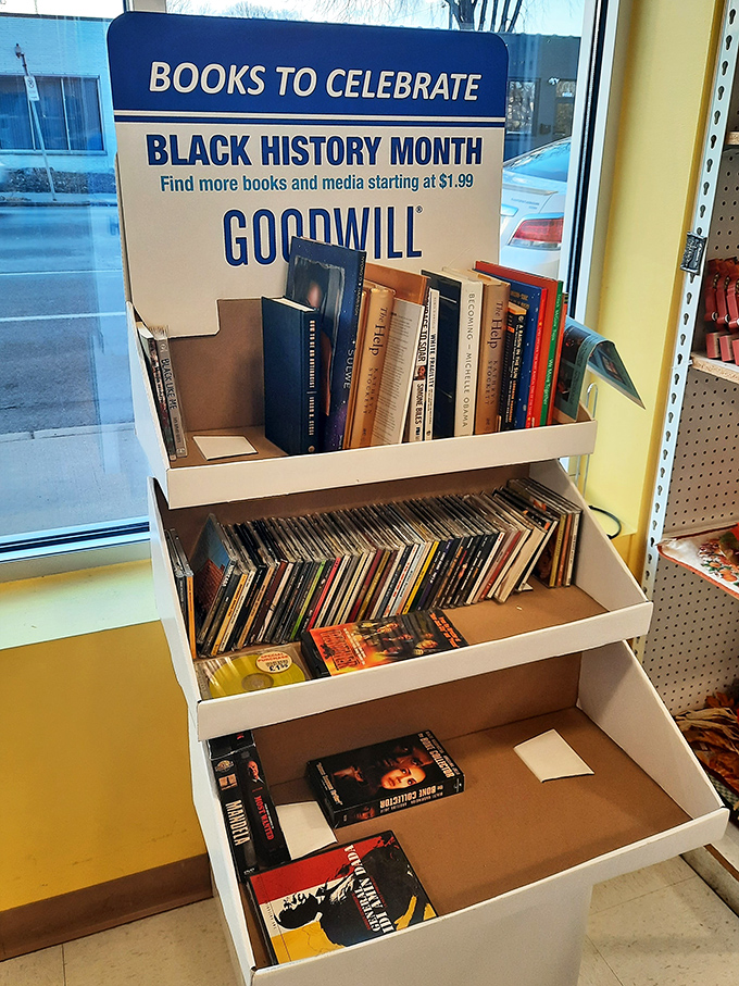 The Black History Month book display showcases the thoughtful curation that elevates this Goodwill beyond mere secondhand store to community resource.