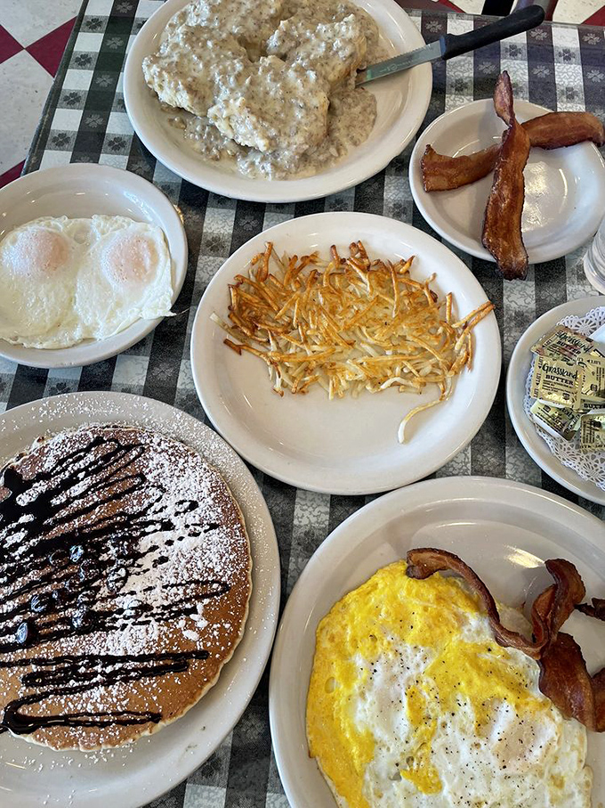 A breakfast spread that would make Ron Swanson weep with joy. From crispy hash browns to fluffy pancakes, this table tells a delicious American story.