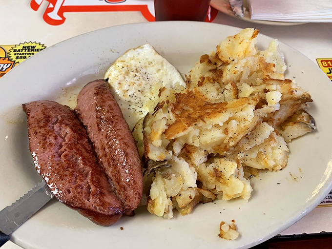 Sausage links, grits, eggs, and biscuits smothered in gravy&mdash;a breakfast platter that says "go back to bed" and "conquer the world" simultaneously.