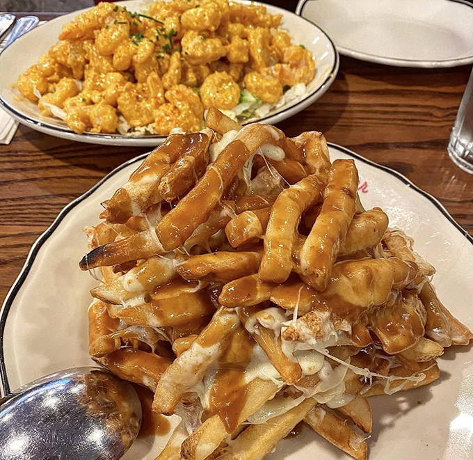 Poutine gets the brunch treatment with a medley of savory ingredients that would make a Canadian weep with joy and a cardiologist reach for their prescription pad.