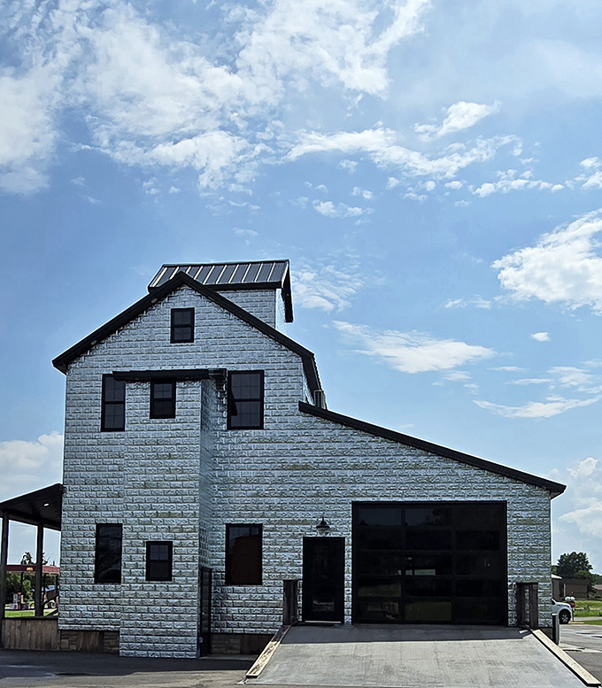 The historic building near the cowbell reminds visitors that Belle honors both its past and present.