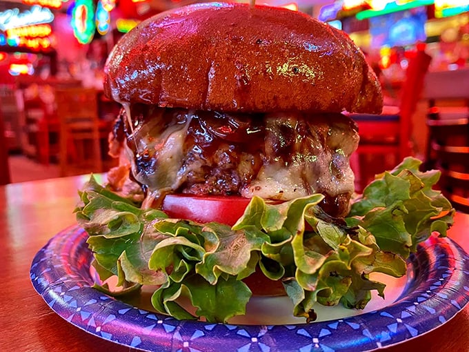 Behold the burger in all its glory! Stacked tall with melty cheese and crispy bacon, it's architecture you can eat and a masterpiece you'll dream about.