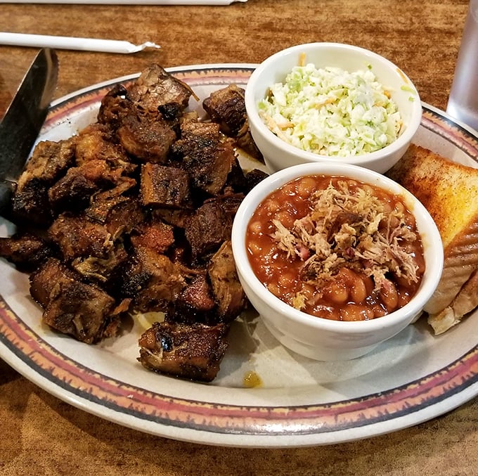Burnt ends—barbecue's greatest gift to humanity. These caramelized brisket nuggets with baked beans and coleslaw are what food dreams are made of.
