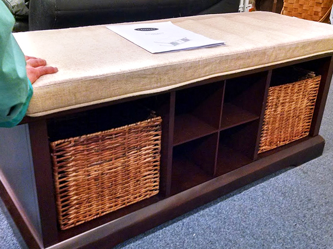 This cushioned storage bench with wicker baskets represents the thrifter's dream: beautiful, functional furniture at a fraction of retail prices.