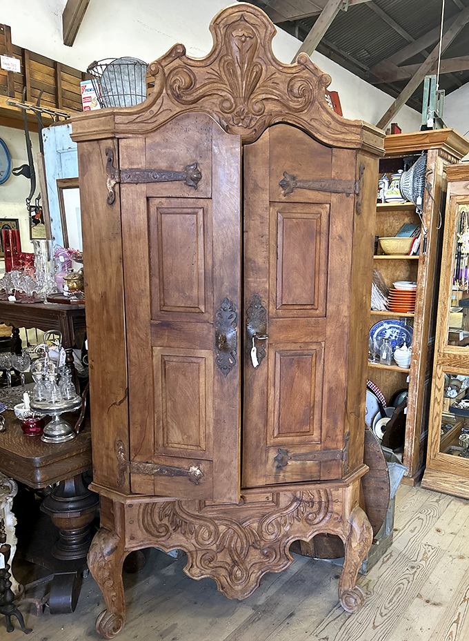 This isn't just a cabinet&mdash;it's a time capsule with doors, its ornate carvings telling tales of craftsmanship from an era before "assembly required" existed.