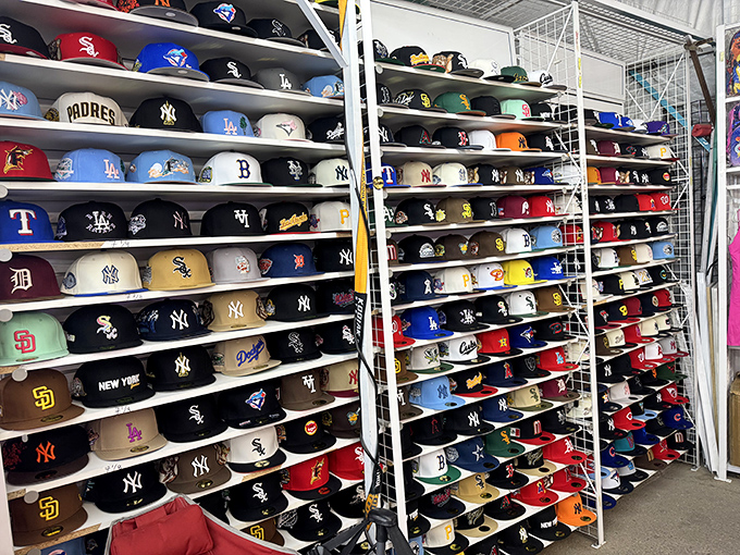 Baseball cap heaven where team loyalty spreads across walls like a sports almanac come to life. Yankees and Dodgers living in peaceful coexistence!