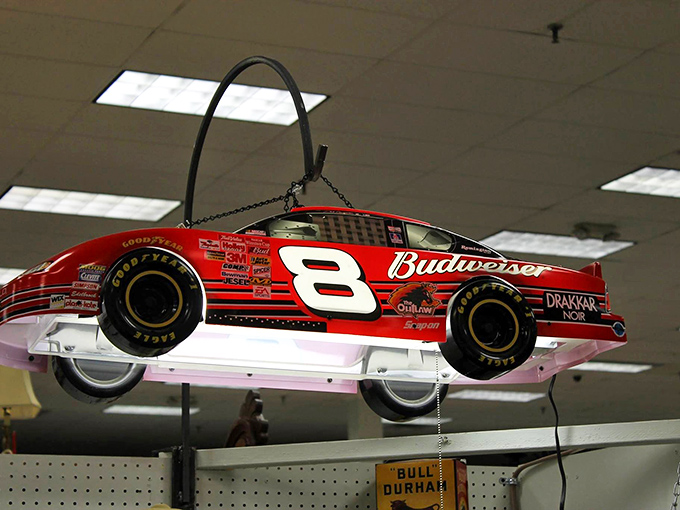 Dale Earnhardt's legacy suspended from the ceiling—NASCAR memorabilia that turns shopping into a spectator sport. The checkered flag of collectibles.