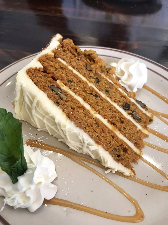 Three layers of carrot cake bliss that somehow manages to be both decadent and worth every calorie. That cream cheese frosting deserves its own fan club.