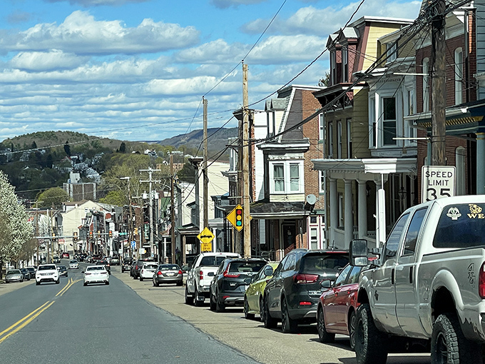 A classic small-town Pennsylvania street, where rows of tidy homes line the road and the distant hills remind you that life still moves at its own easy pace.