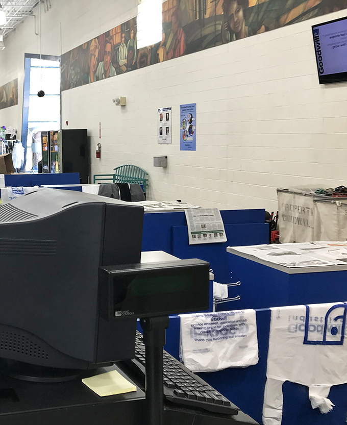Behind every great thrift store is an efficient checkout system and a mural reminding us of the human connection in commerce.