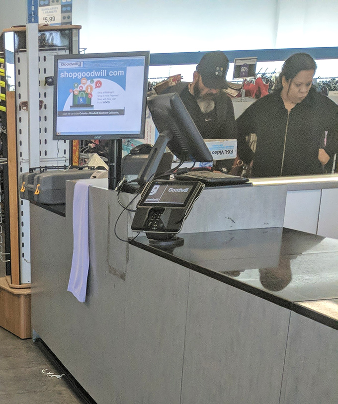 The checkout area – where the thrill of the hunt culminates in that magical moment when your pile of treasures costs less than a fancy coffee drink.