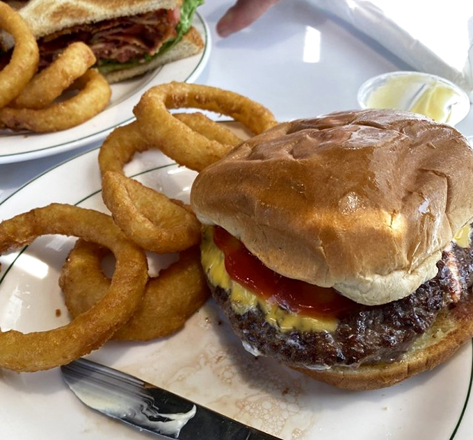 The cheeseburger that launched a thousand road trips. Those onion rings aren't side characters&mdash;they're co-stars in this delicious drama.