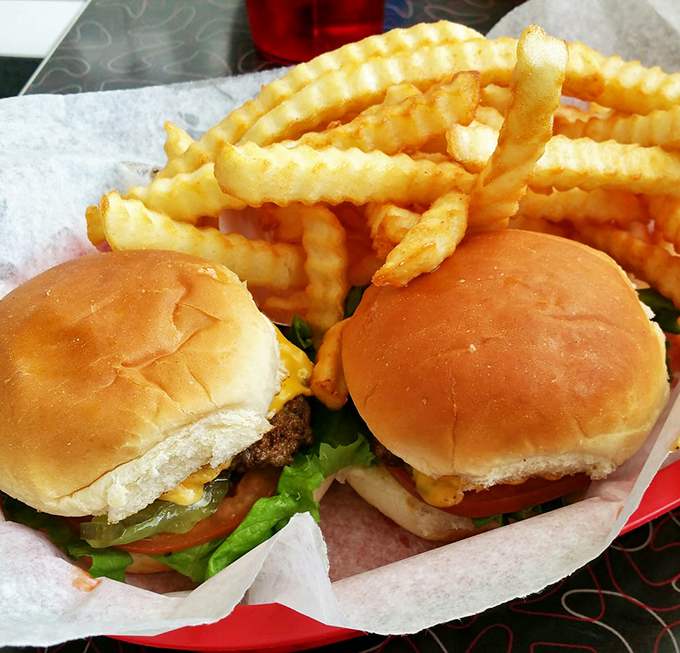 Two perfectly humble cheeseburgers that prove fancy toppings and artisanal buns are just distractions from burger perfection.