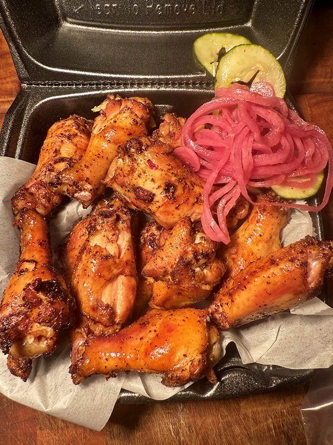 These wings aren't trying to fly anywhere except straight to your taste buds, escorted by those gorgeous pink pickled onions.